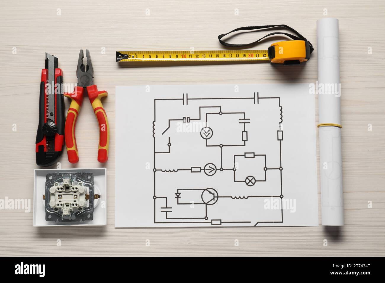 Knife and tape measure on wooden table top view hi-res stock ...