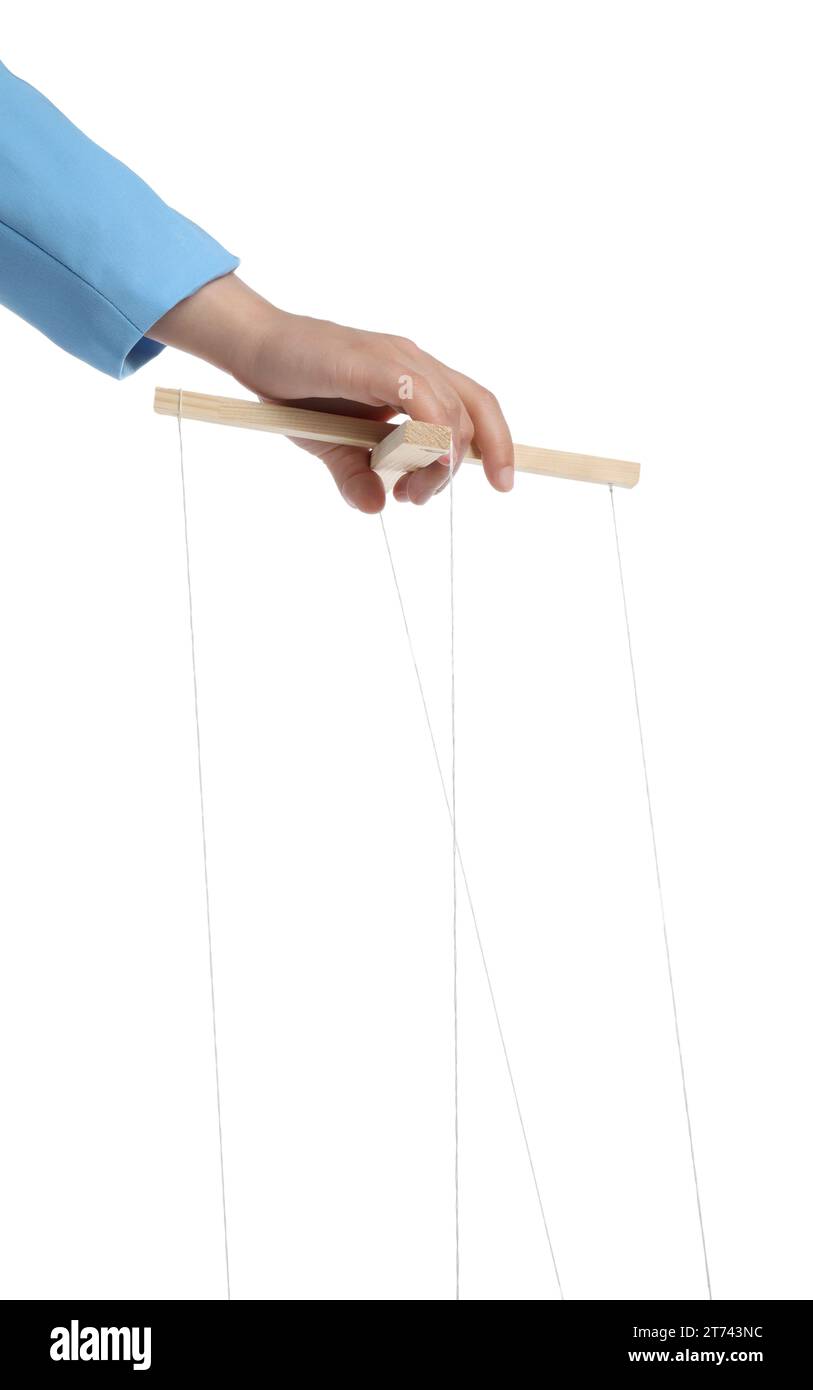 Woman pulling strings of puppet on white background, closeup Stock ...