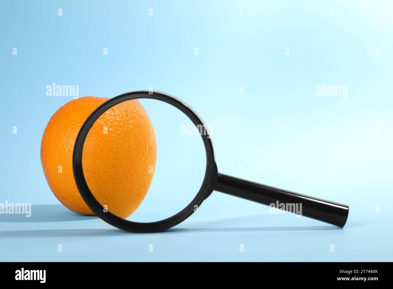 Cellulite problem. Zoomed orange peel on light blue background, view ...