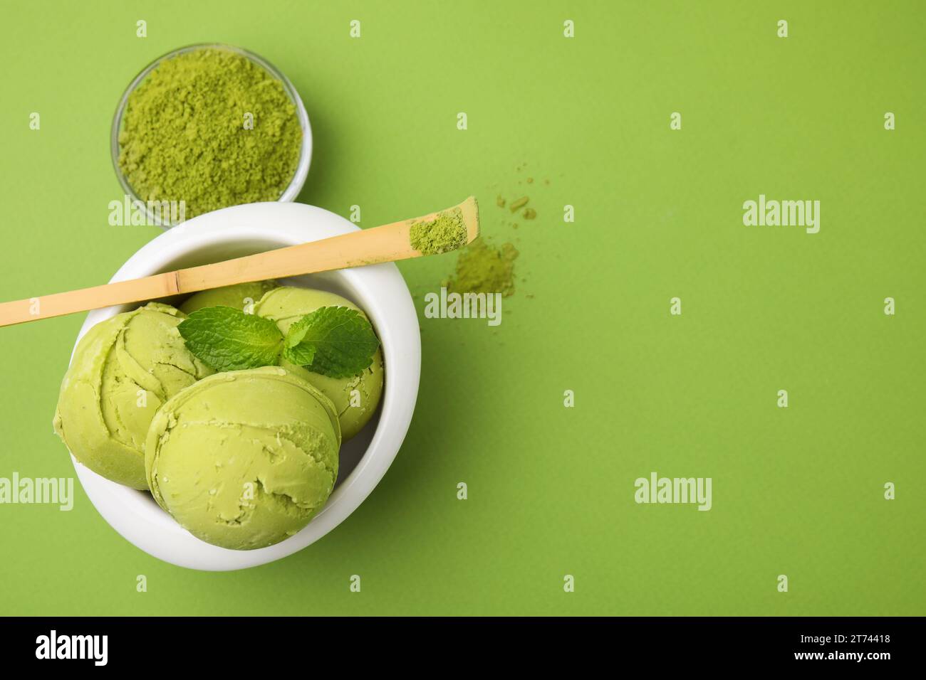 Tasty matcha ice cream and powder on light green background, flat lay ...