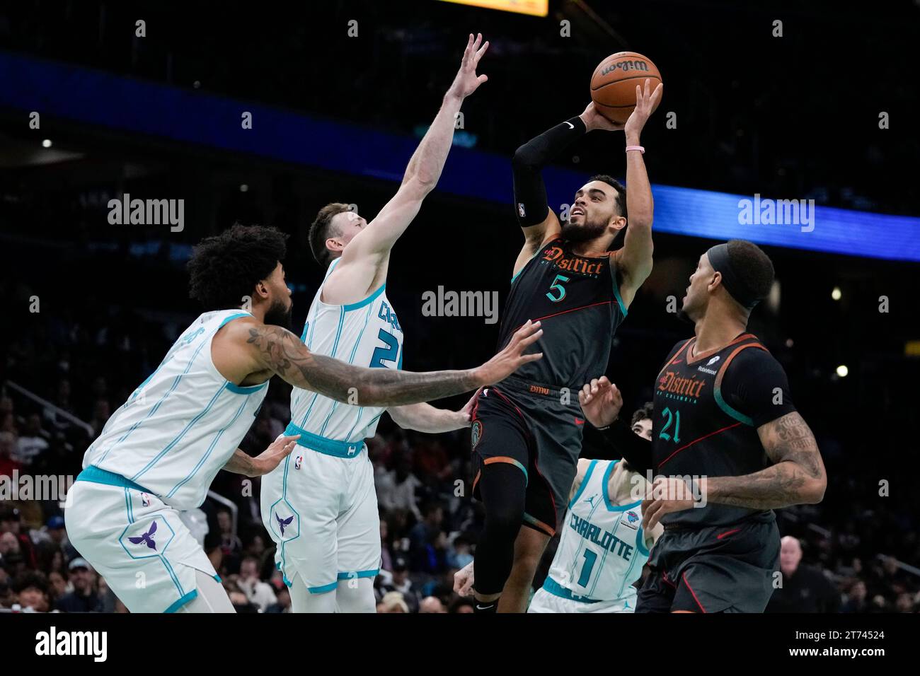 From left, Charlotte Hornets center Nick Richards, forward Gordon ...