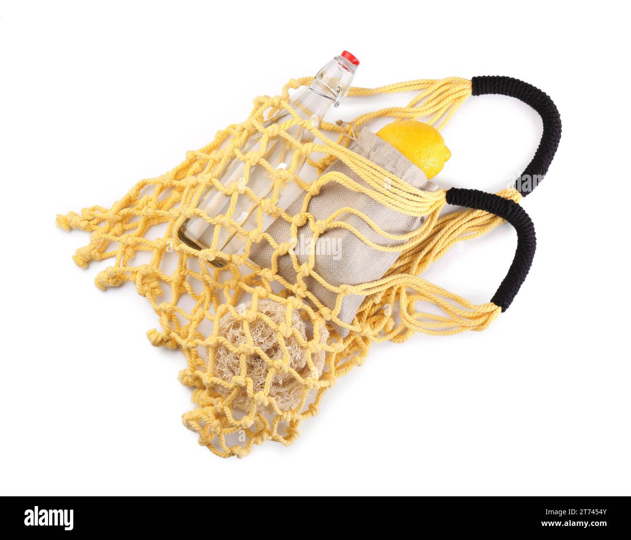 Fishnet bag with different items isolated on white, top view. Conscious ...