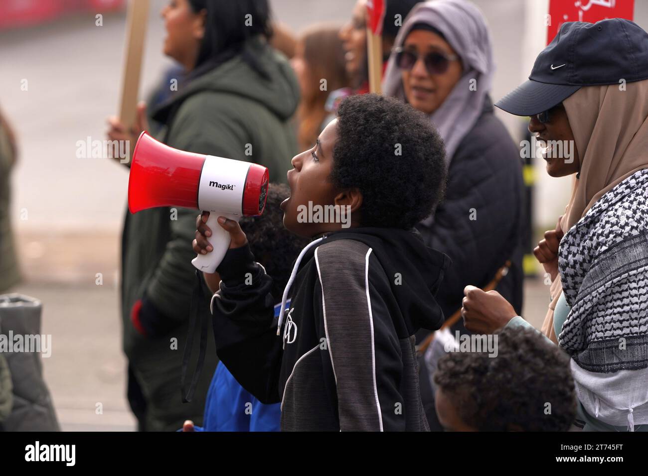 Young black boy with a megaphone at the Pro Palestine March in Cardiff ...