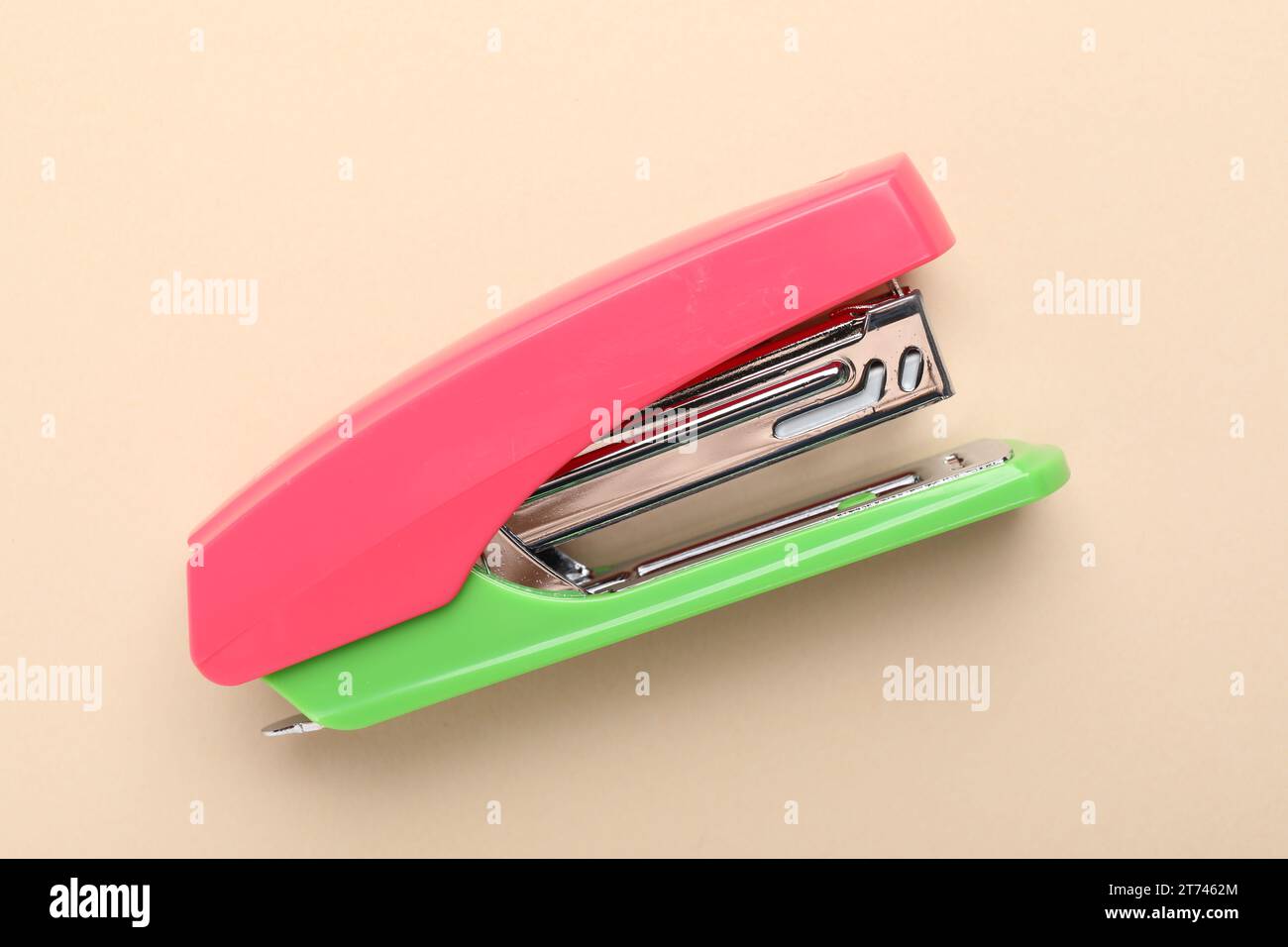 One bright stapler on beige background, top view Stock Photo - Alamy