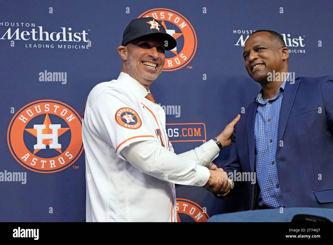 Houston Astros new baseball team manager Joe Espada, left, shakes hands ...