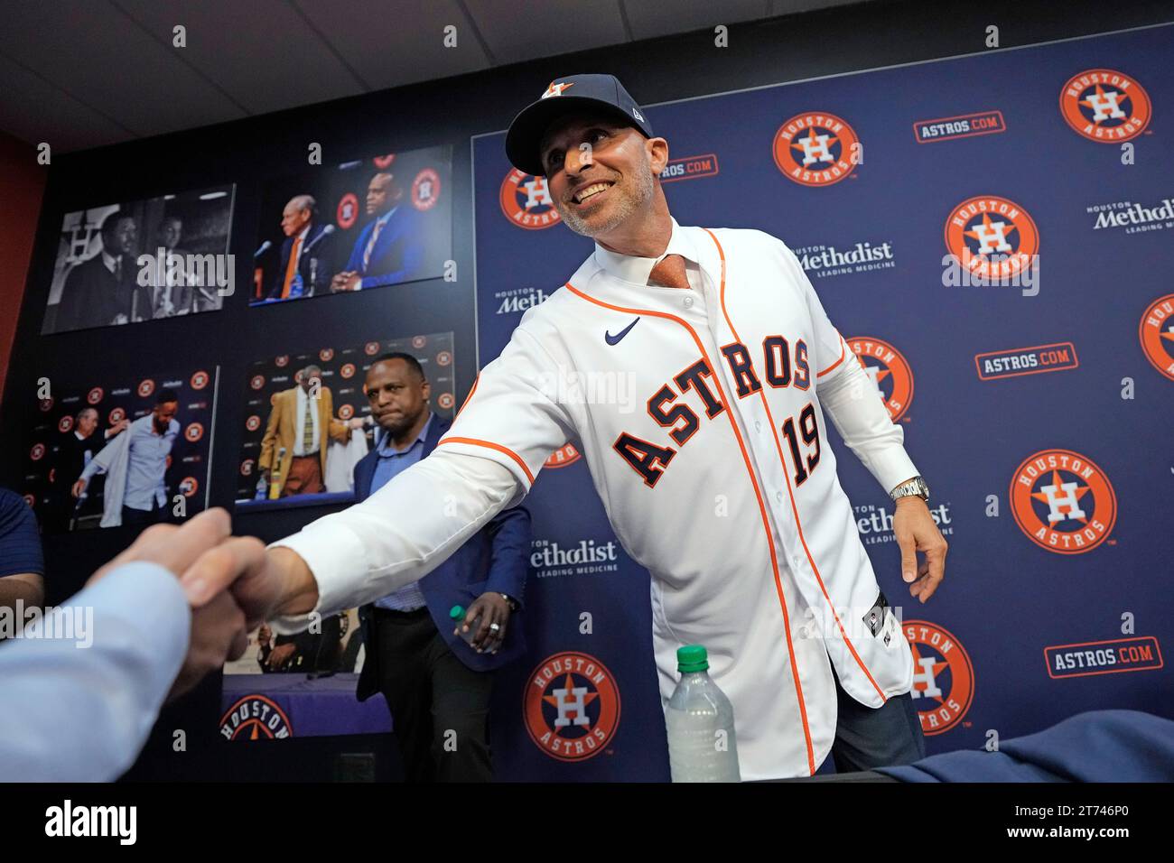 Houston Astros manager Joe Espada is congratulated after a news ...