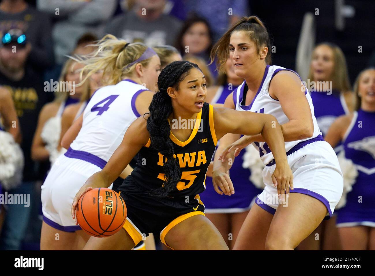 Iowa forward Hannah Stuelke (45) drives around Northern Iowa forward ...
