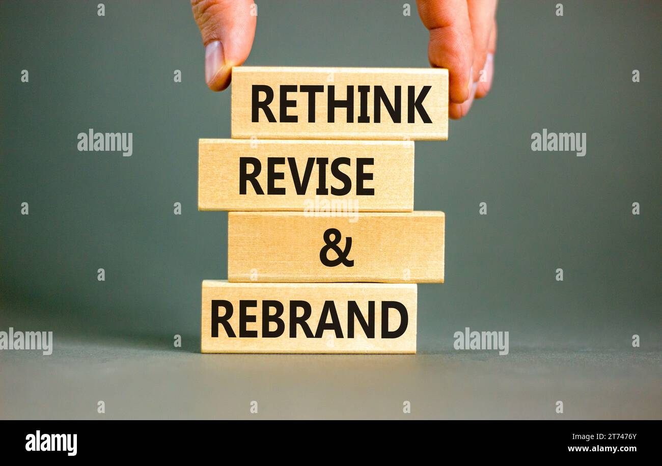 Rethink revise rebrand symbol. Concept word Rethink Revise and Rebrand on beautiful block ...