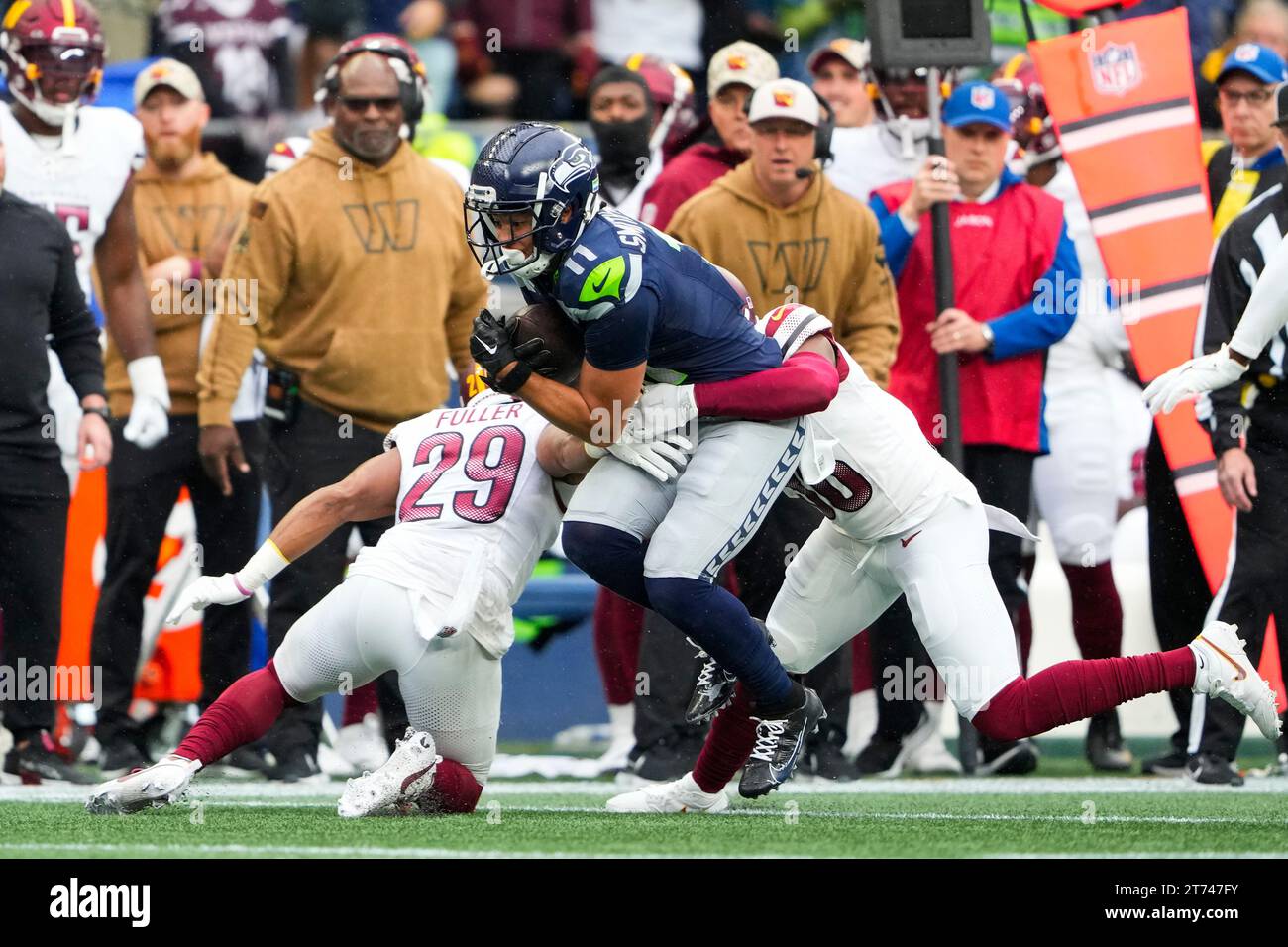 Seattle Seahawks wide receiver Jaxon Smith-Njigba is tackled by Washington Commanders cornerback ...