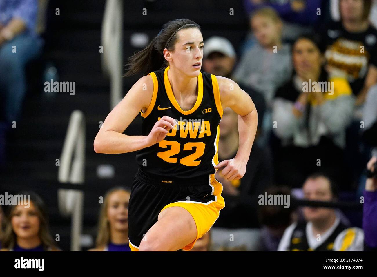 Iowa guard Caitlin Clark (22) runs up court during the first half of an ...