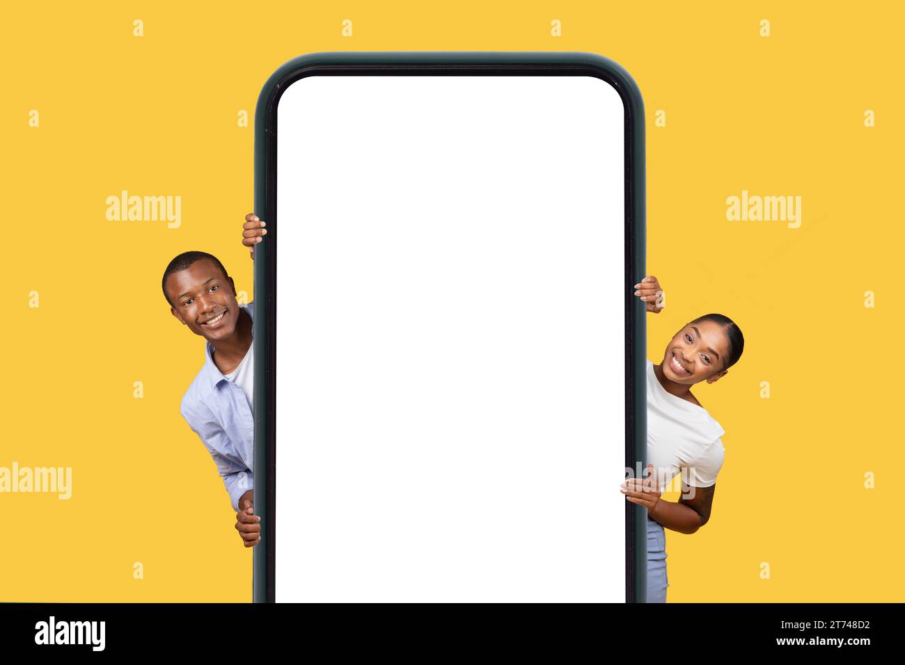 Black couple peeking from behind huge blank phone screen banner Stock ...