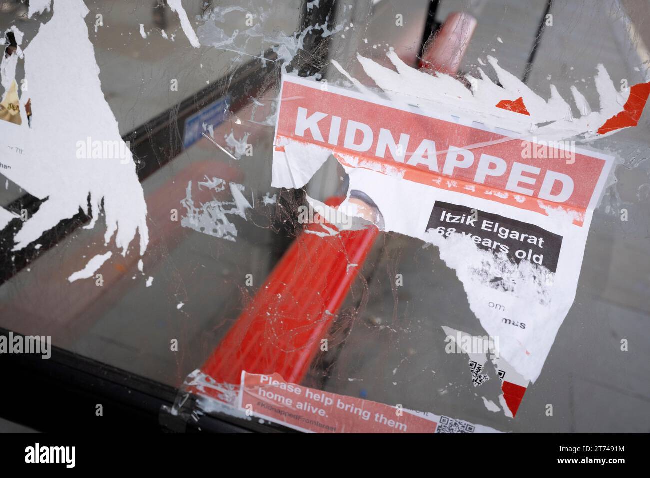 Flyers and posters showing the names and faces of Israeli hostages ...