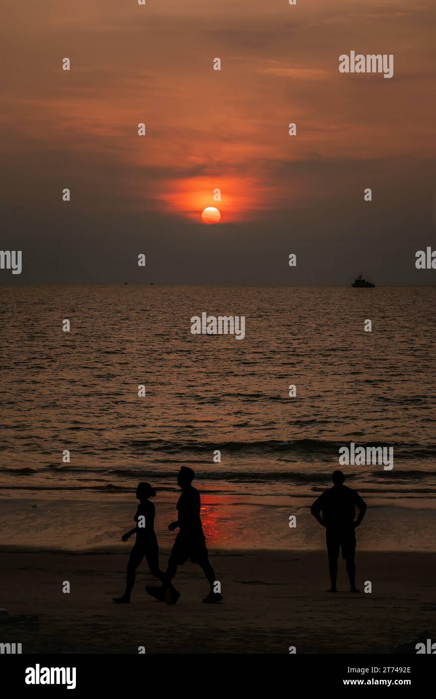 Vertical photo of Dramatic red sunset, Sun behind foggy clouds ...