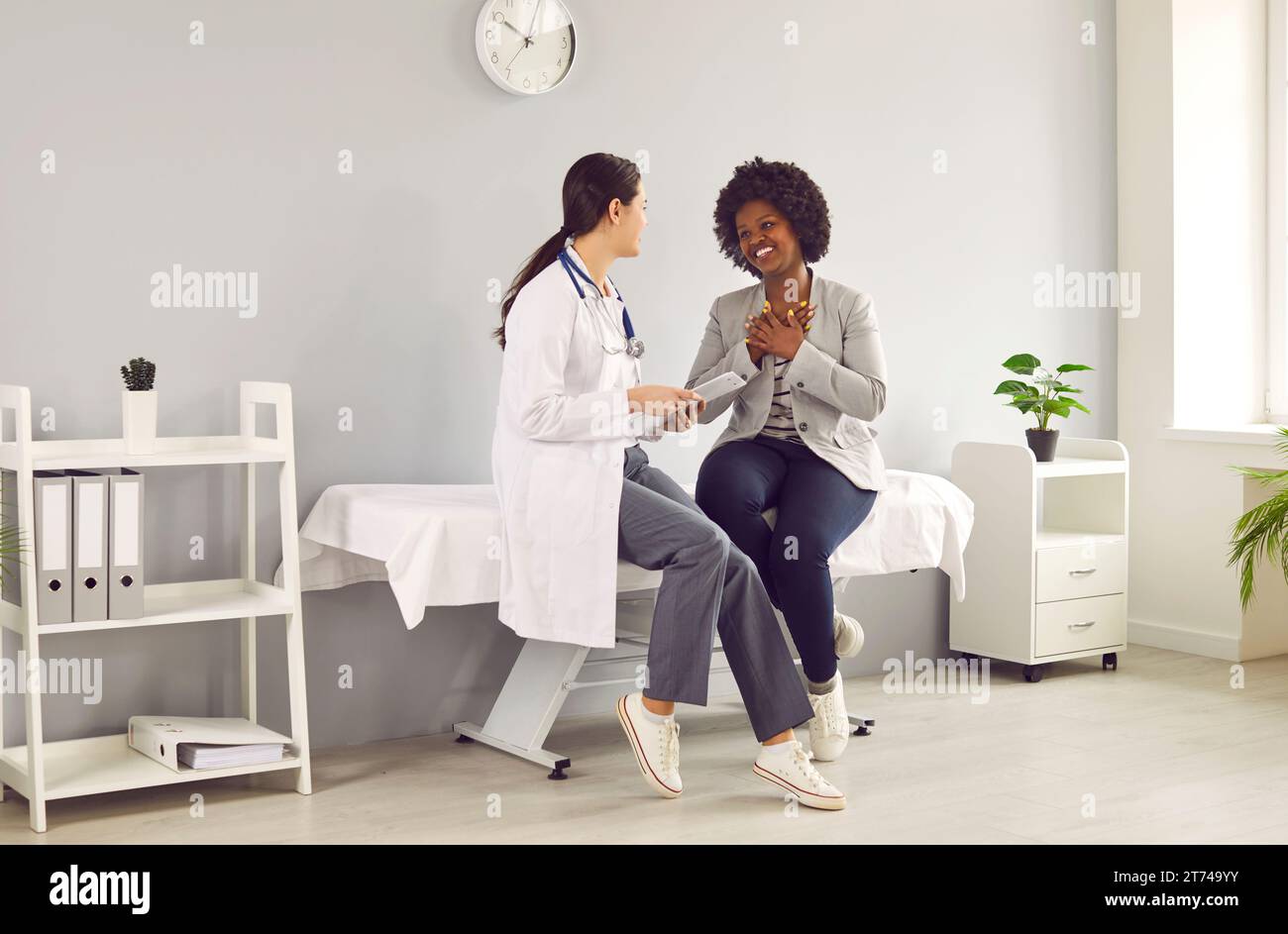 Female GP doctor having discussion about patient diagnosis Stock Photo ...