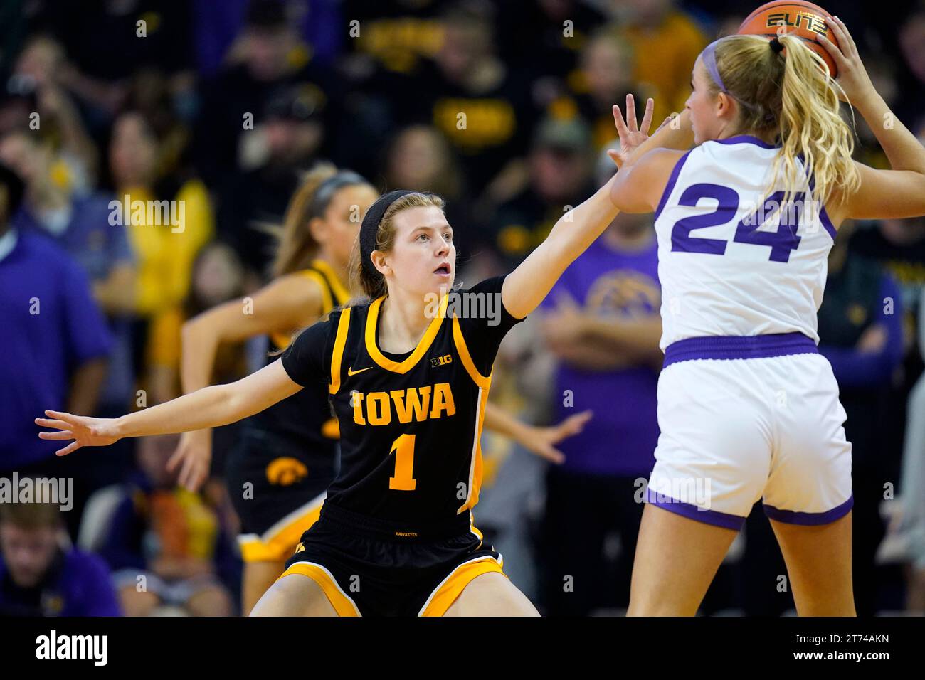 Iowa guard Molly Davis (1) defends Northern Iowa guard Kayba Laube (24 ...