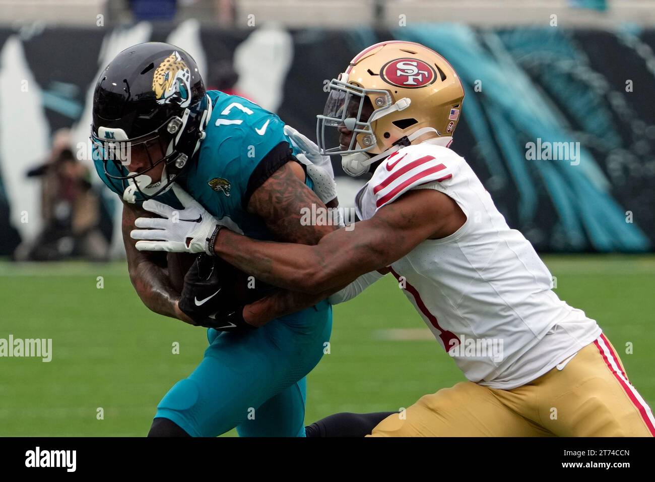 Jacksonville Jaguars tight end Evan Engram (17) tires to get past San ...
