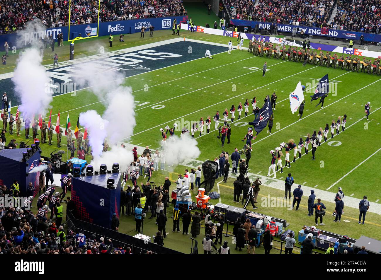 The New England Patriots take the field before an NFL football game ...