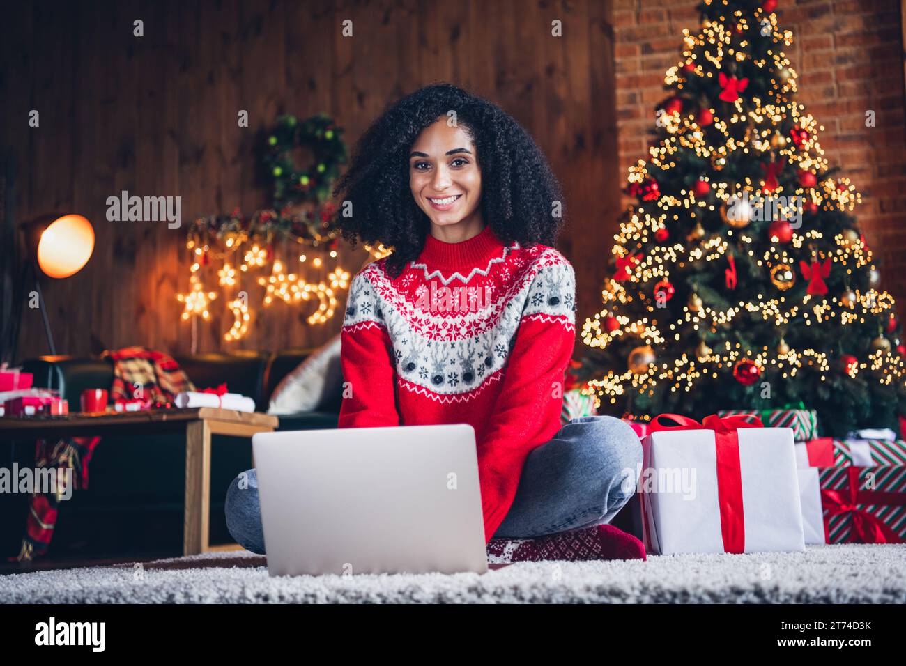 Full size portrait of gorgeous cheerful girl sit carpet floor use netbook eshopping evergreen ...