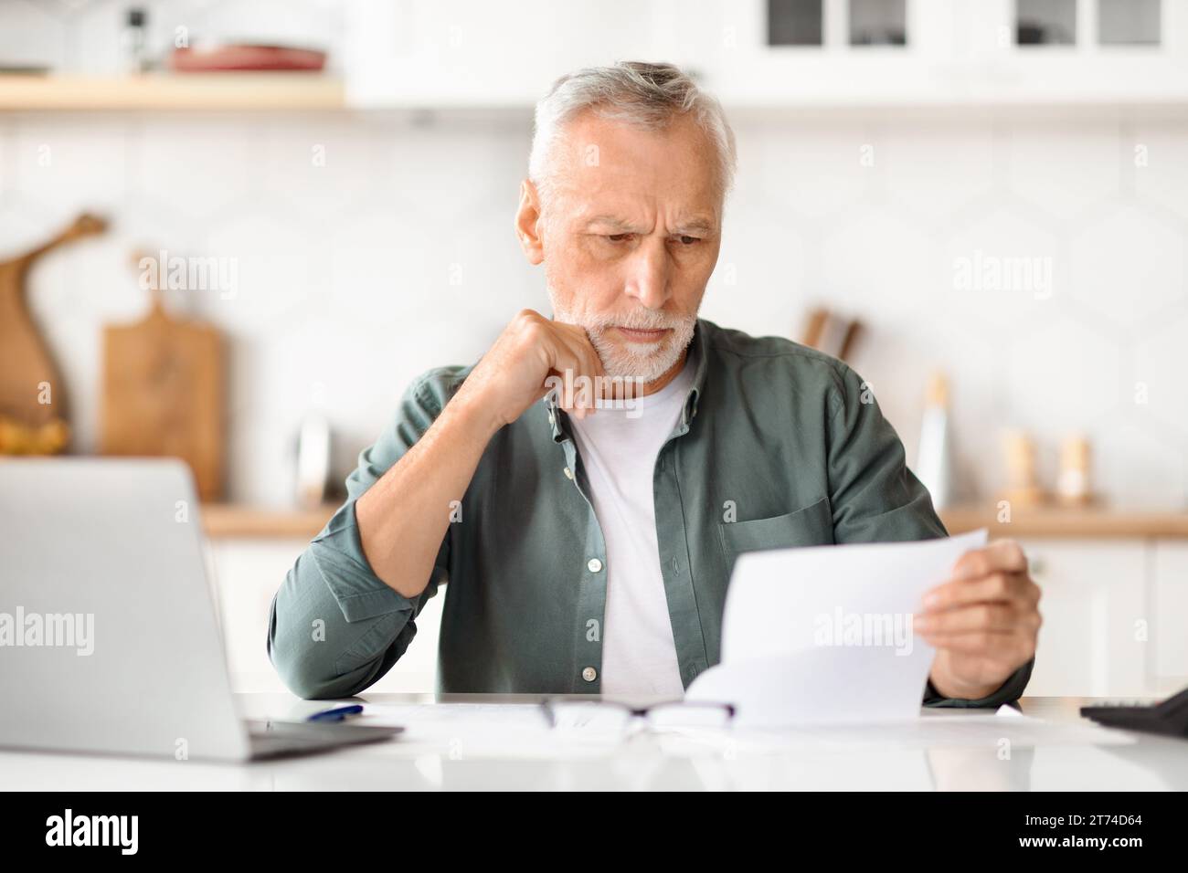 Casual old man reading documents hi-res stock photography and images ...