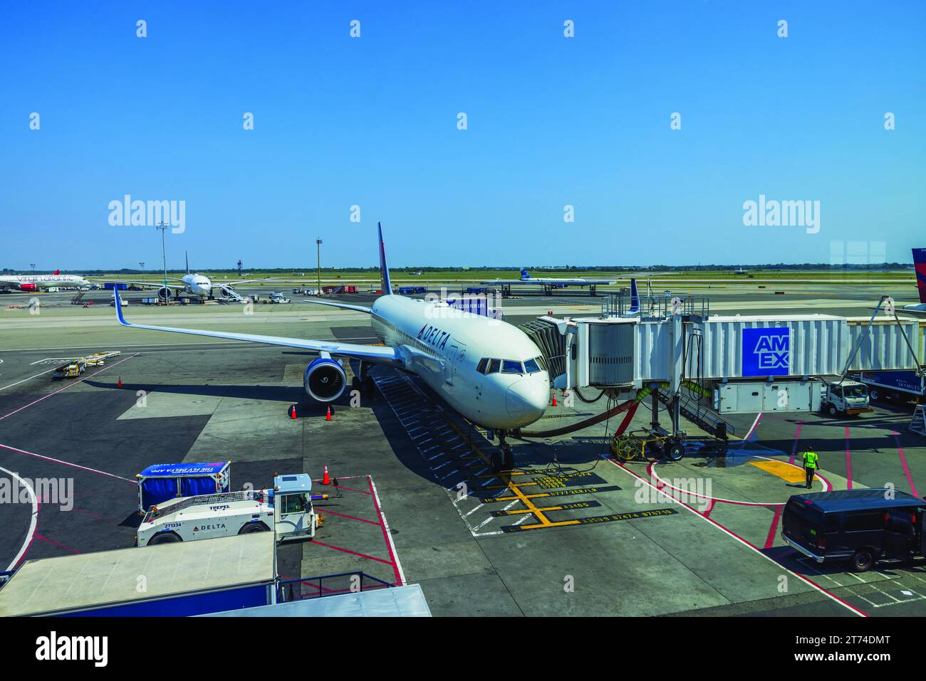 Close-up view of parked Delta Airlines jet connected to boarding bridge ...
