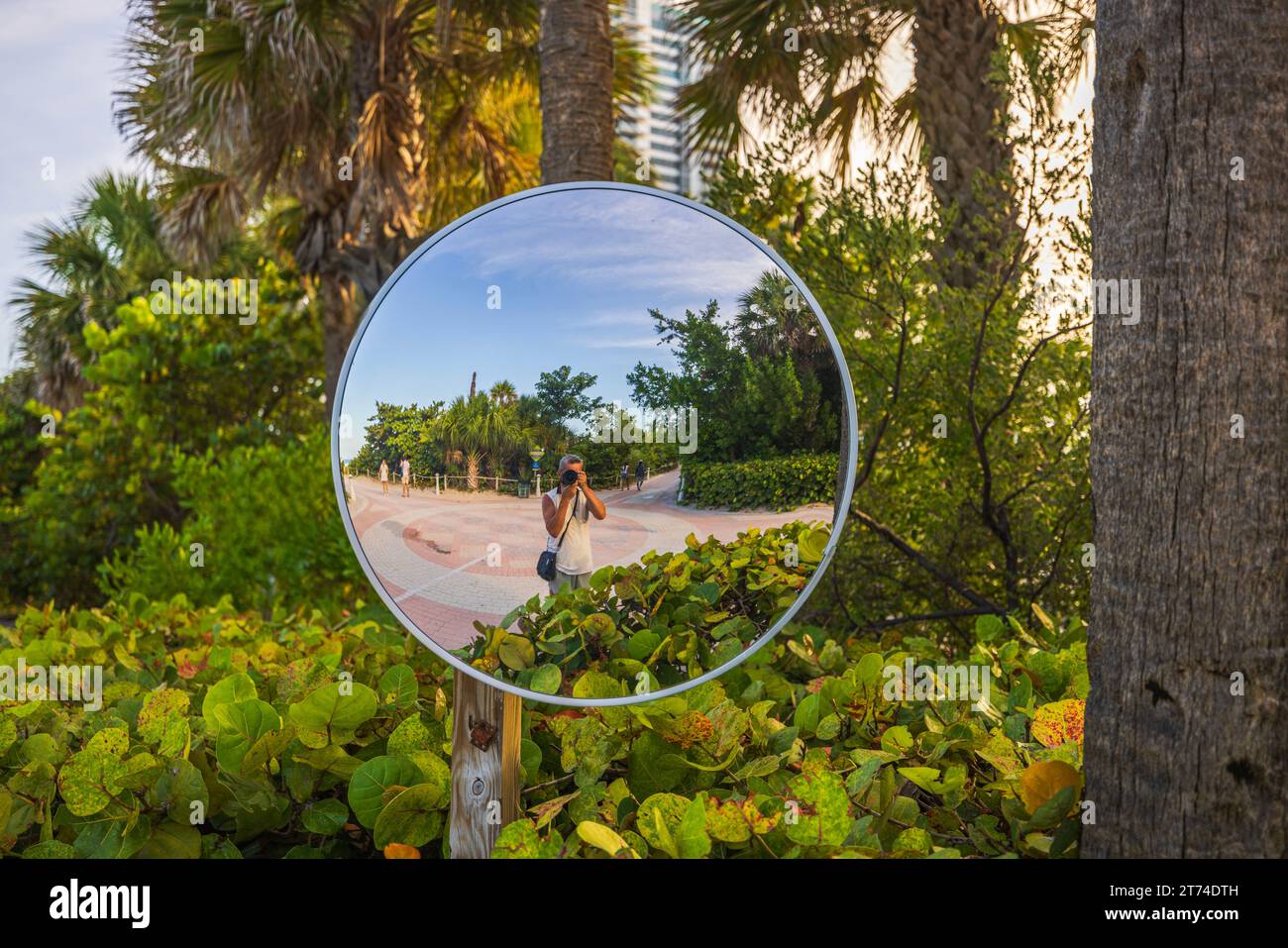 Man captures his reflection in convex traffic safety mirror against ...