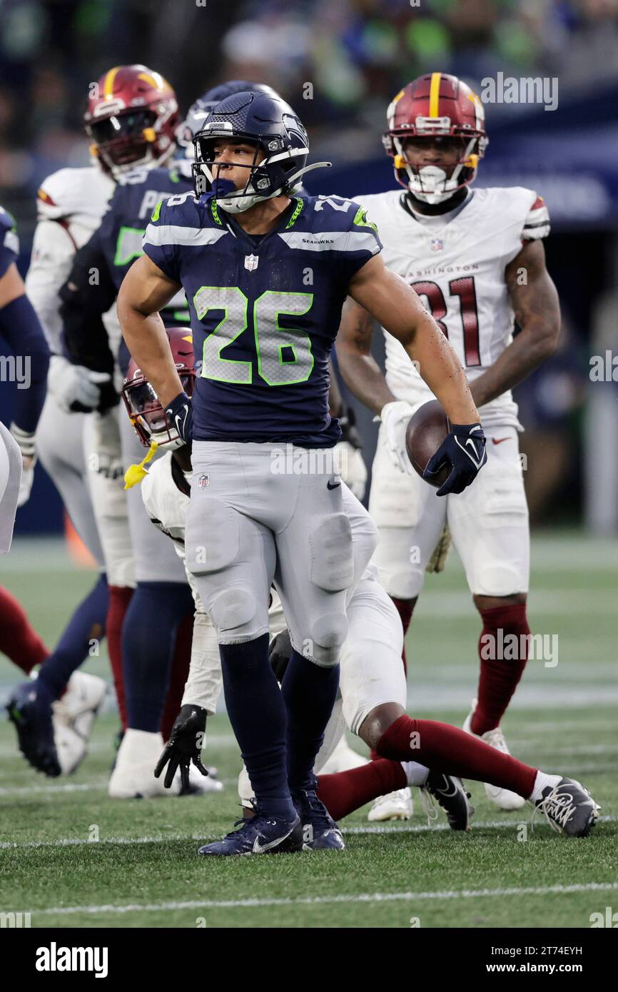 Seattle Seahawks running back Zach Charbonnet stands with the ball ...