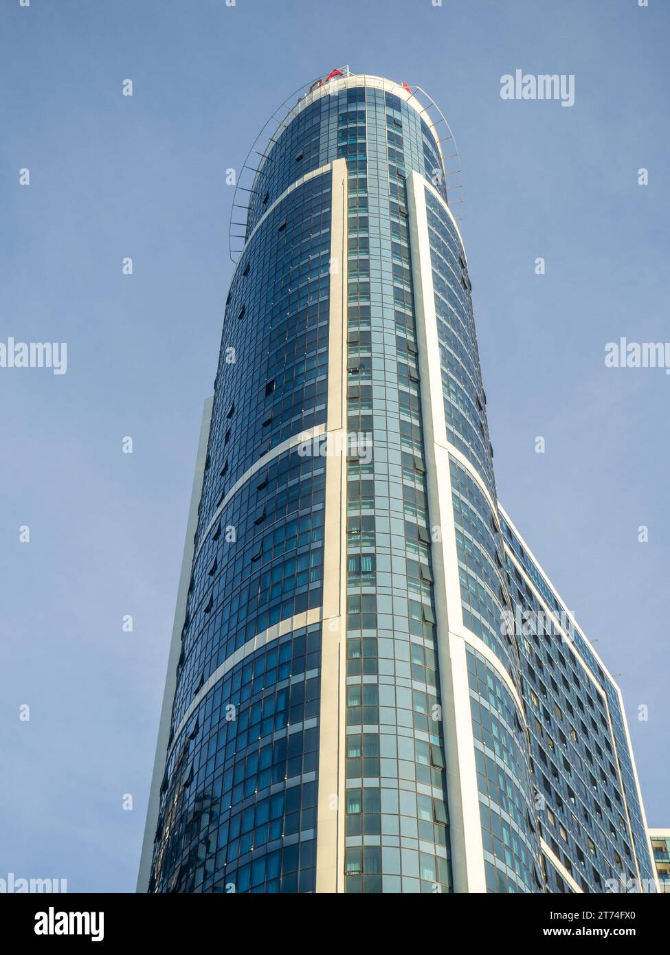 Glass facade of a house under construction with open windows. Windows ...
