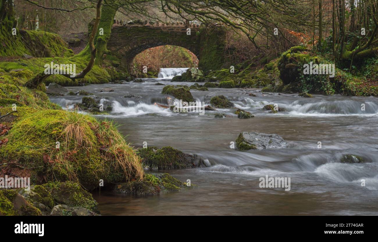 View of the fast flowing Weir Water at Robbers Bridge, Hookway Hill ...