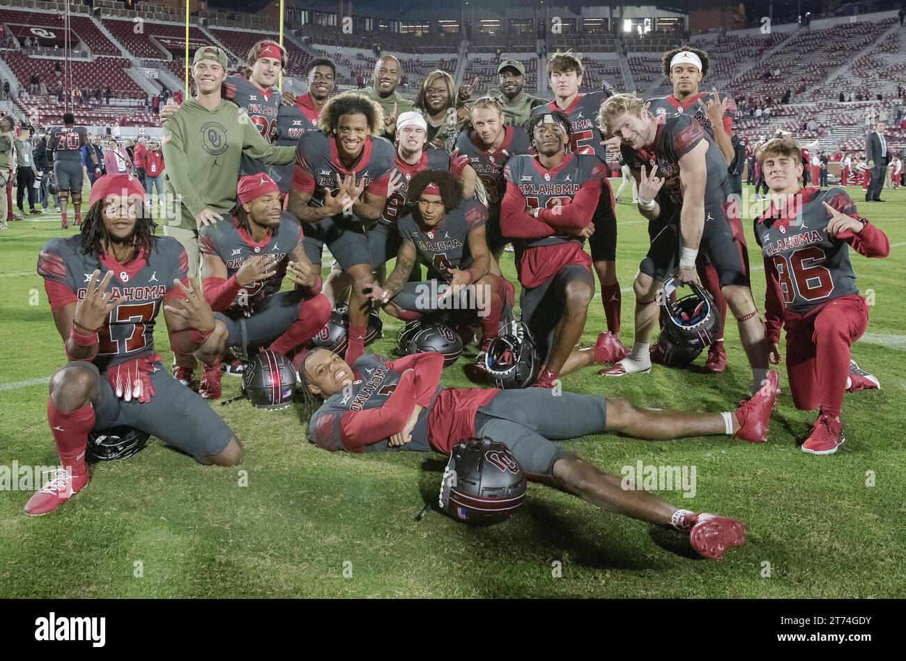 Oklahoma players pose for a photo after an NCAA college football game ...