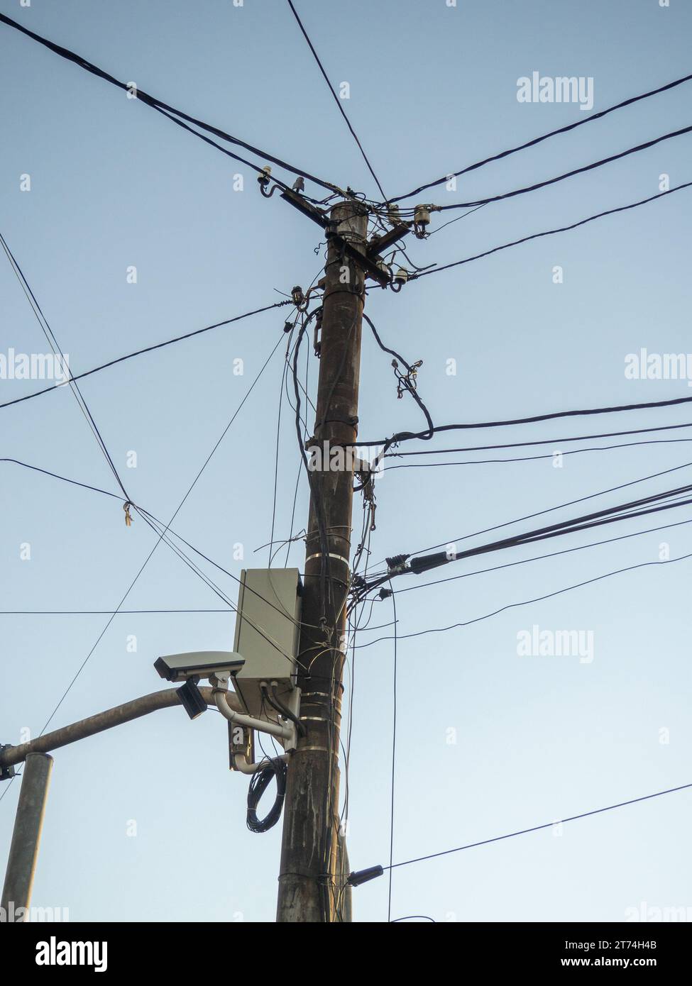 Old power line. New street camera on an old pole. Communications ...