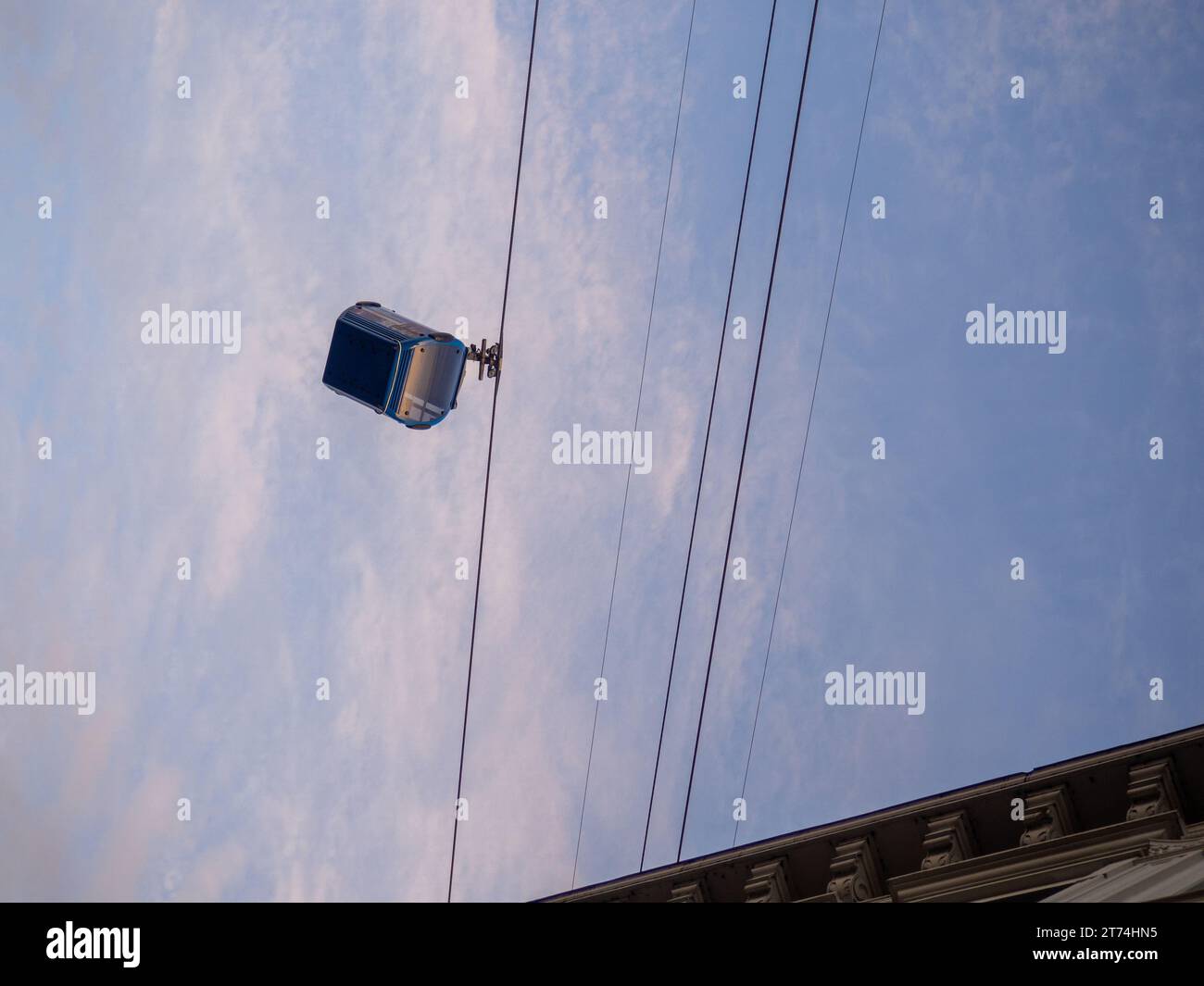 Cabins on a rope. Ropeway. Cabin silhouette. Road in the city on a lift ...