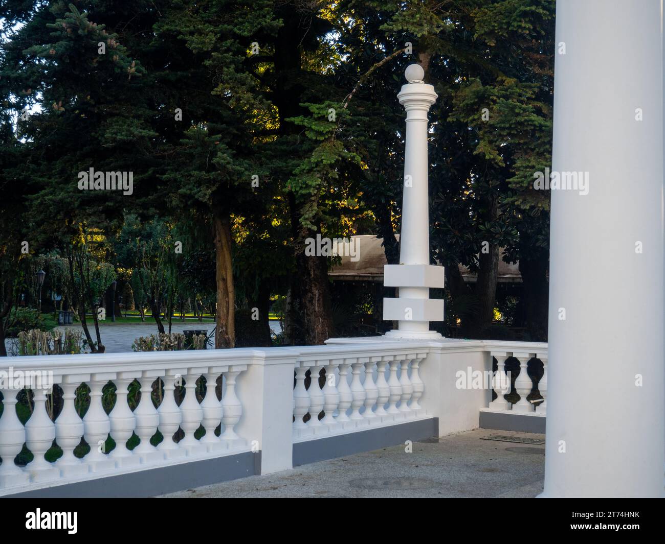 White decorative column in the park. Park decoration. Architecture of ...