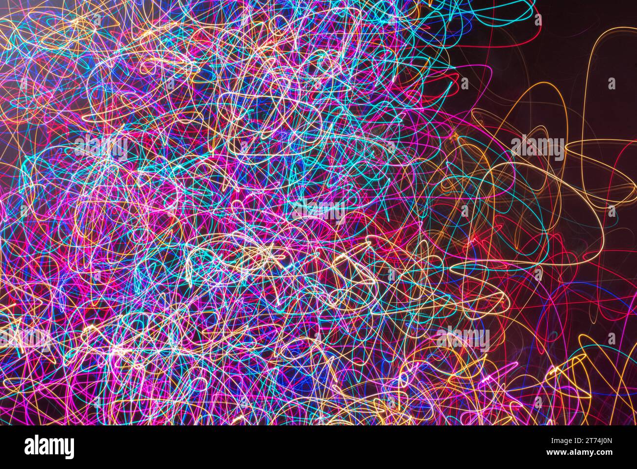 Abstract light painting of multiple bright, glowing neon colors, with a ...
