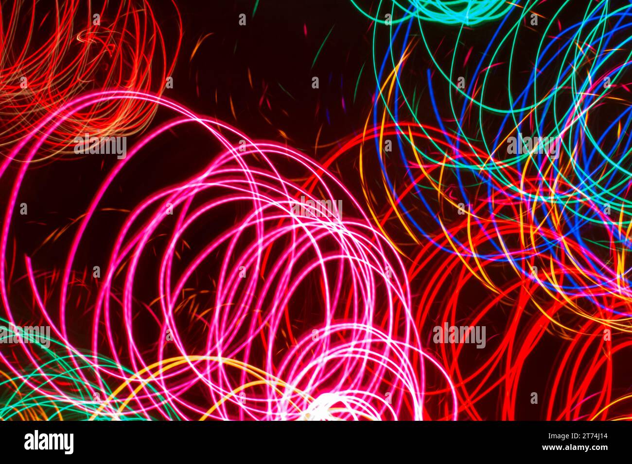 Abstract light painting of multiple warm, glowing neon colors, with a ...