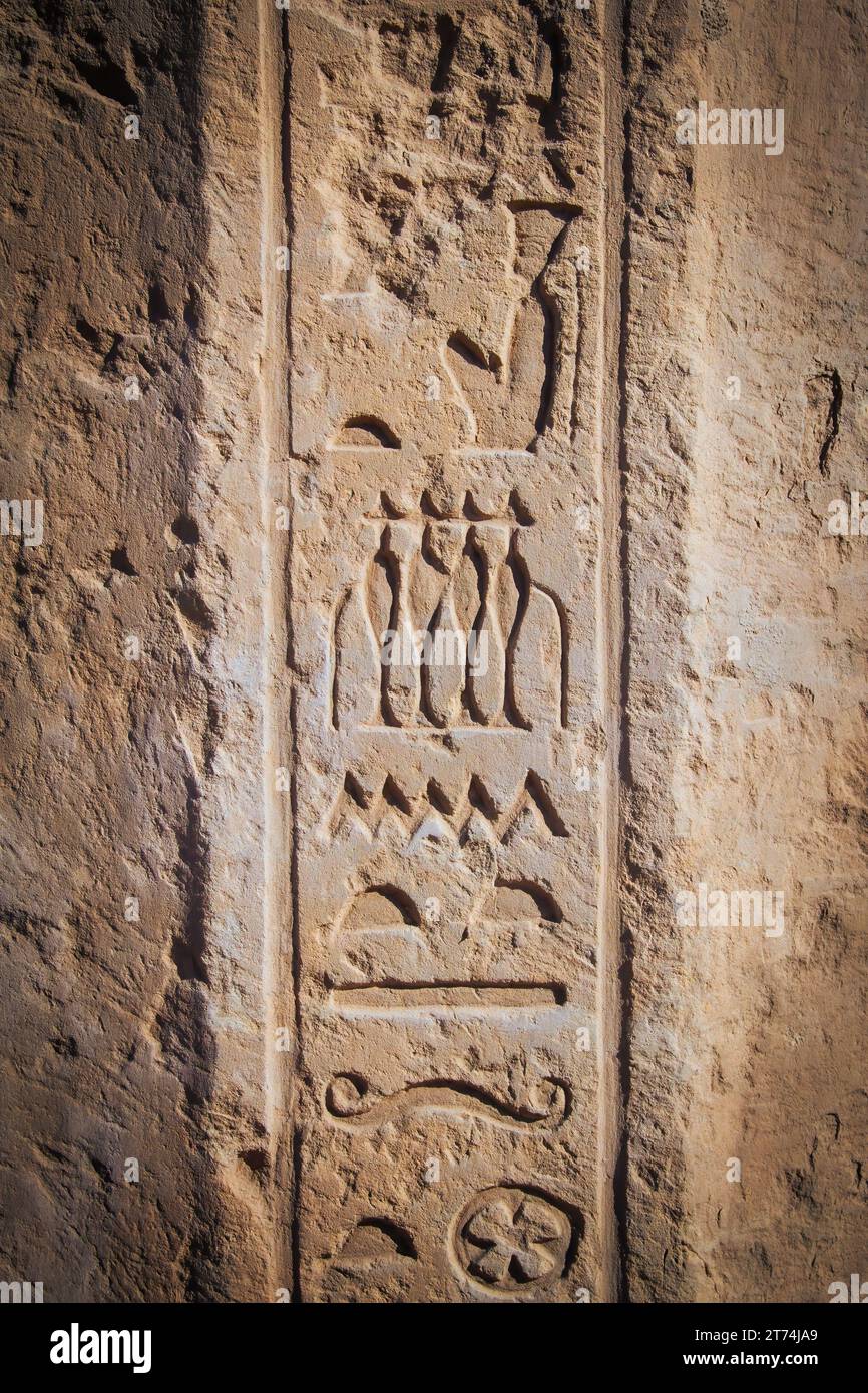 Egyptian hieroglyphs on an ancient wall. Egypt. Edited as a vintage ...