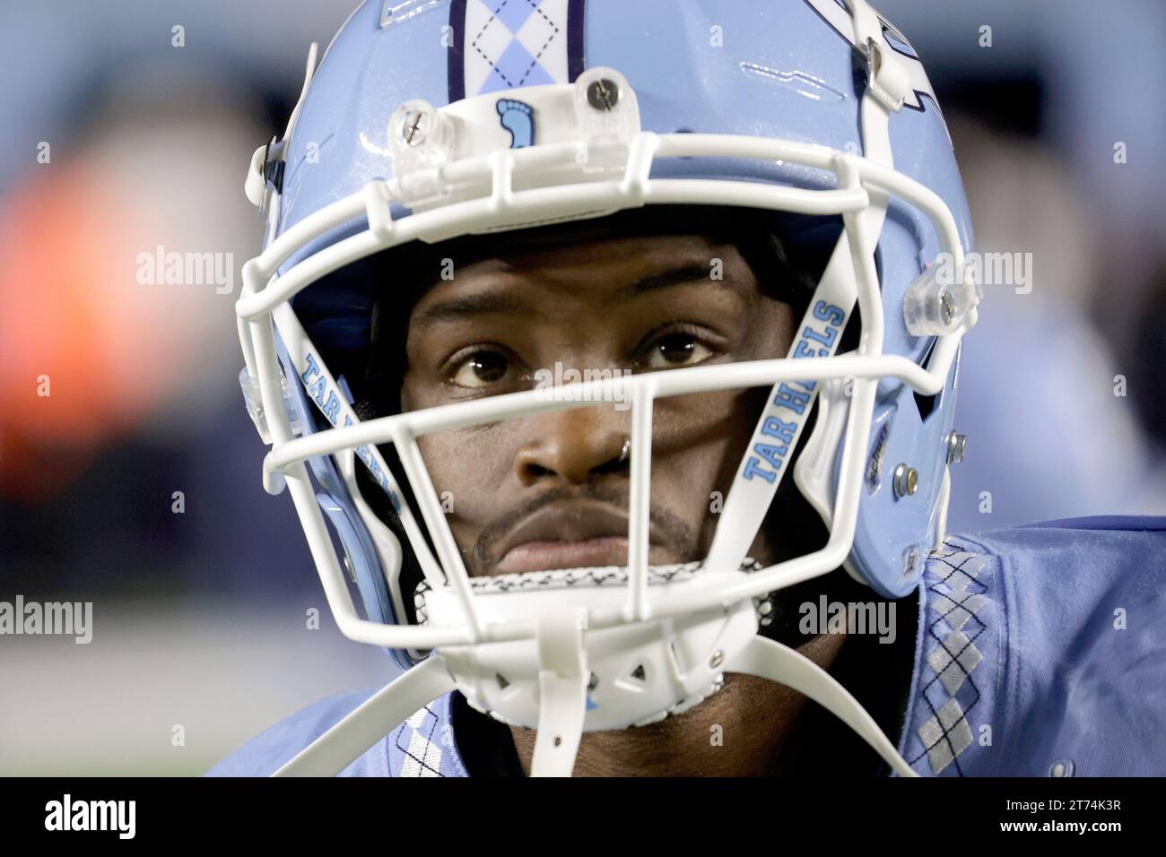 North Carolina wide receiver Devontez Walker looks up as he stretches ...
