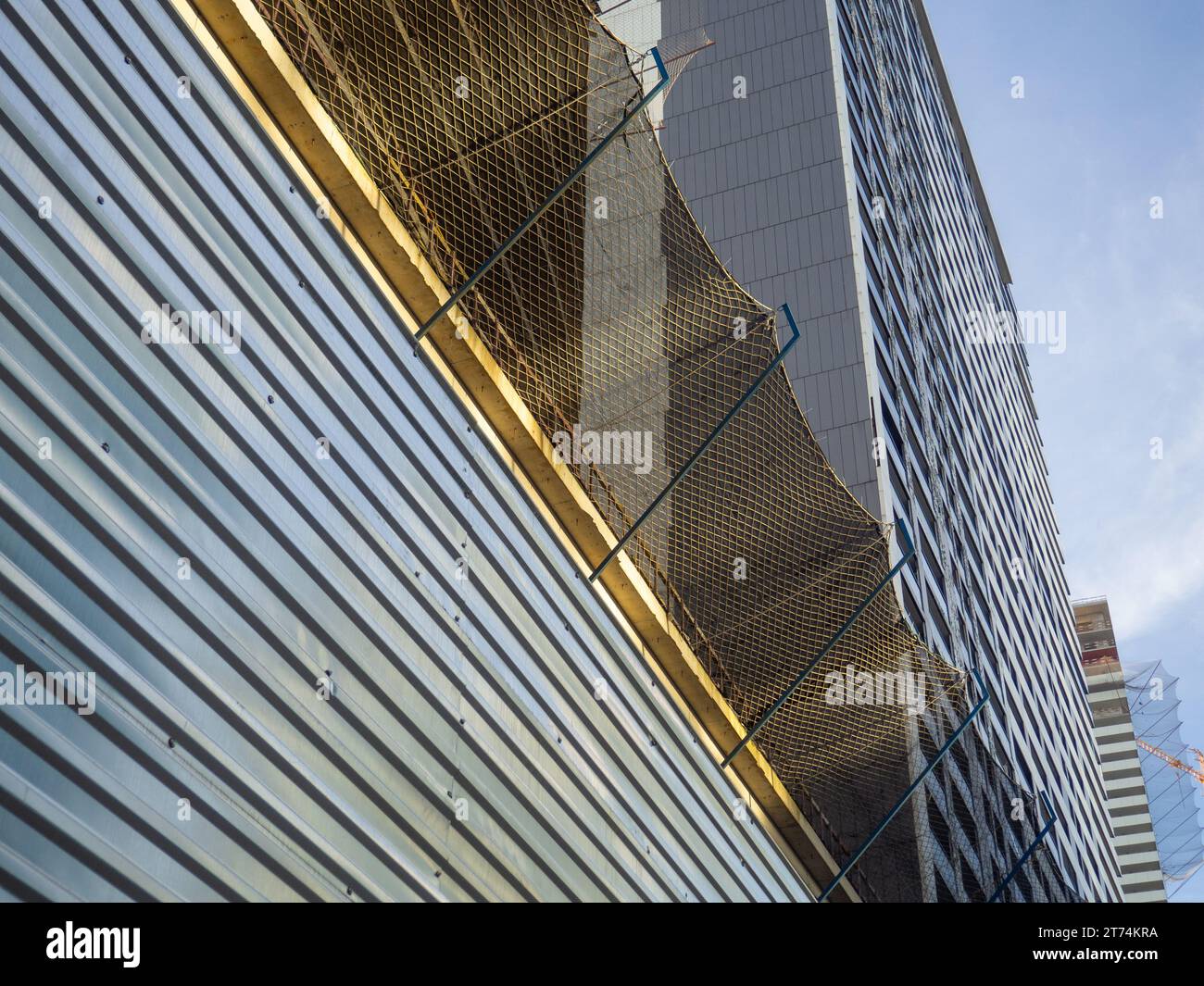 Glass facade of a house under construction with open windows ...