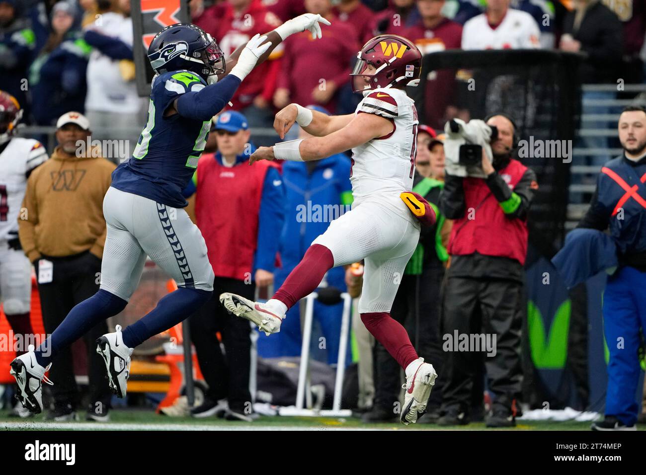 Seattle Seahawks linebacker Boye Mafe, left, pressures Washington ...
