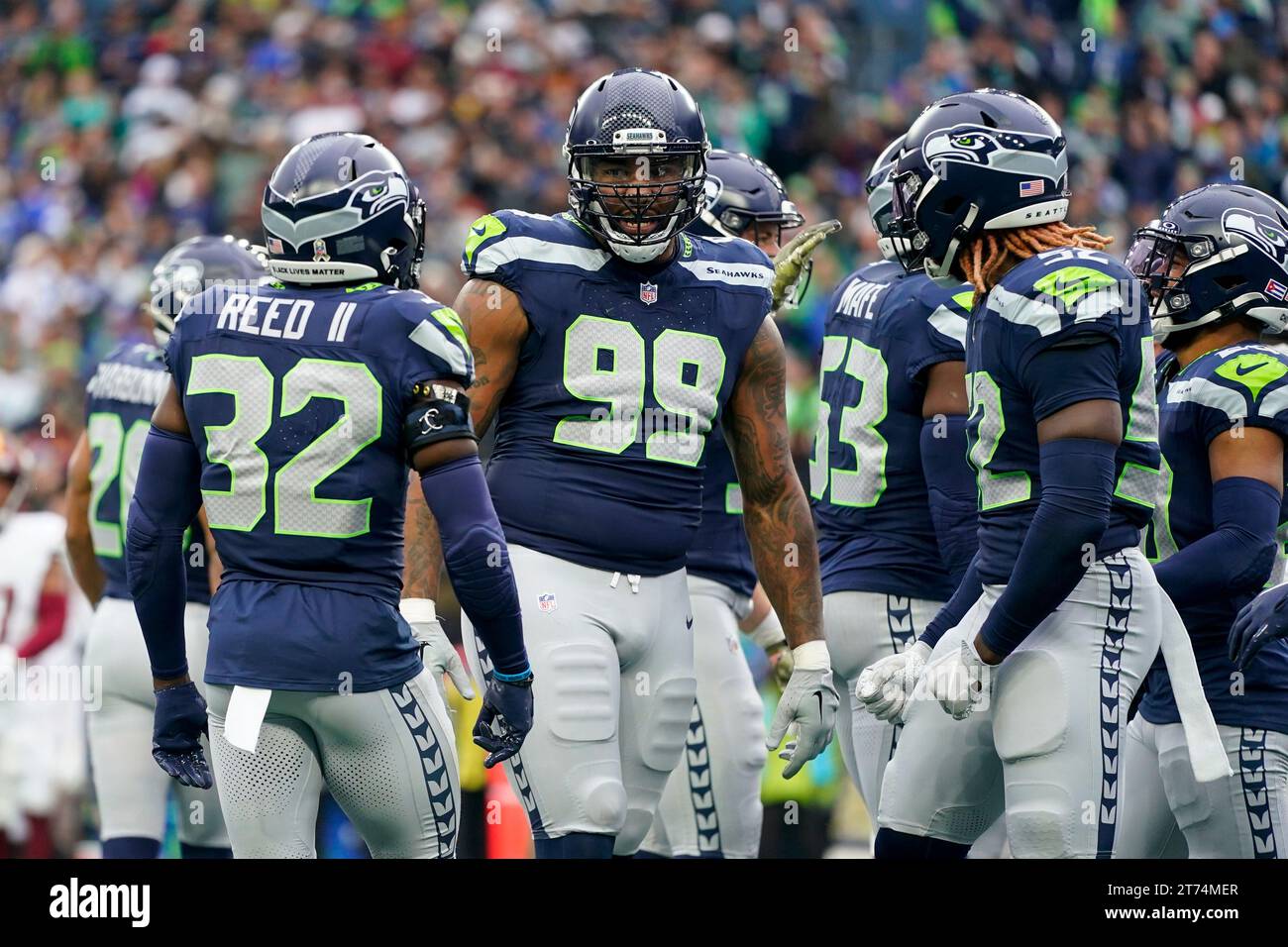 Seattle Seahawks defensive end Leonard Williams (99) is greeted by ...