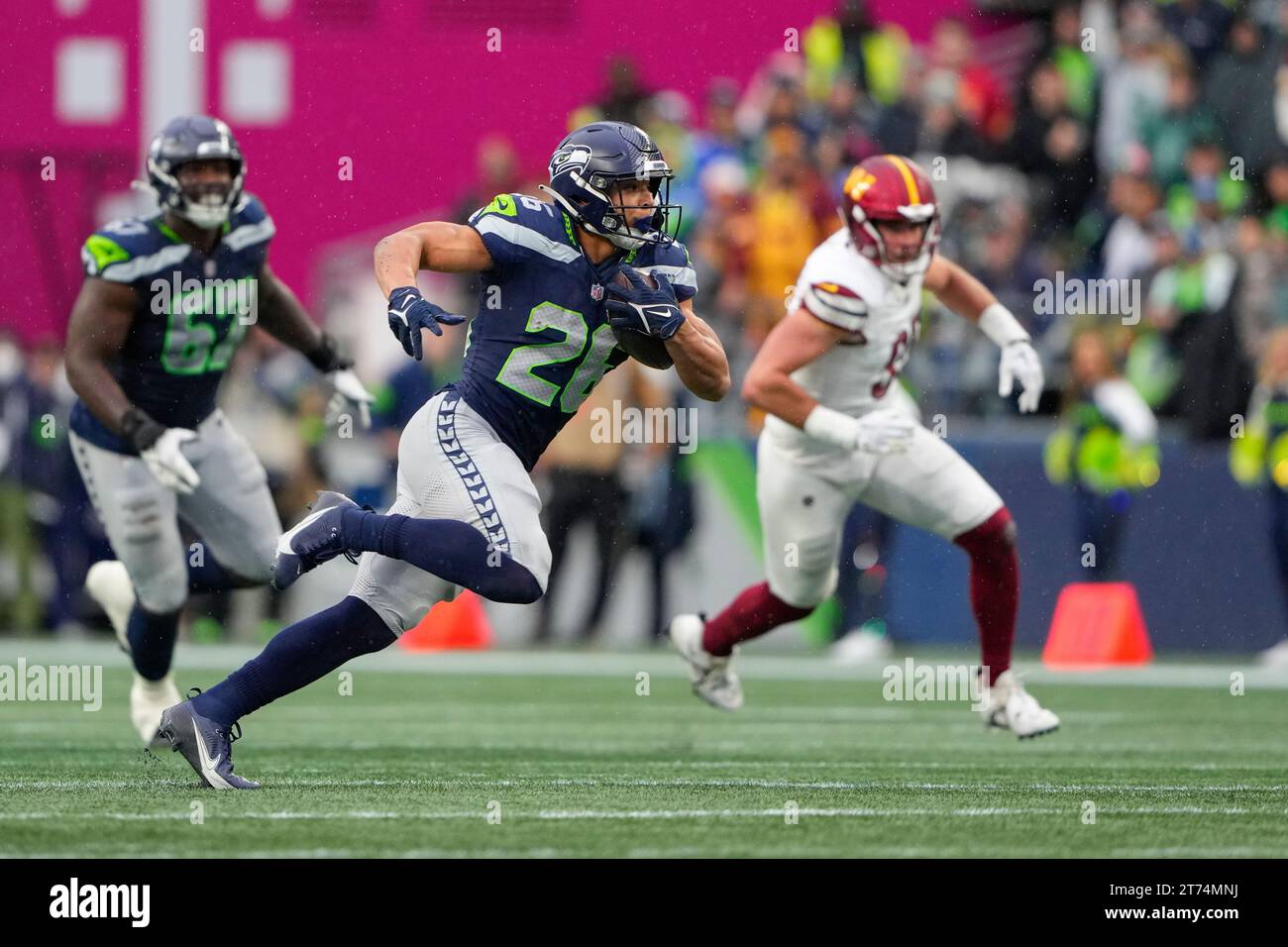 Seattle Seahawks running back Zach Charbonnet runs the ball against the ...