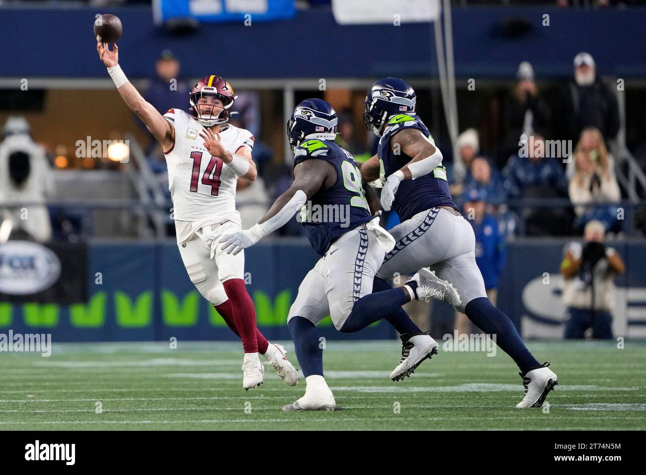Washington Commanders quarterback Sam Howell (14) throws against the ...