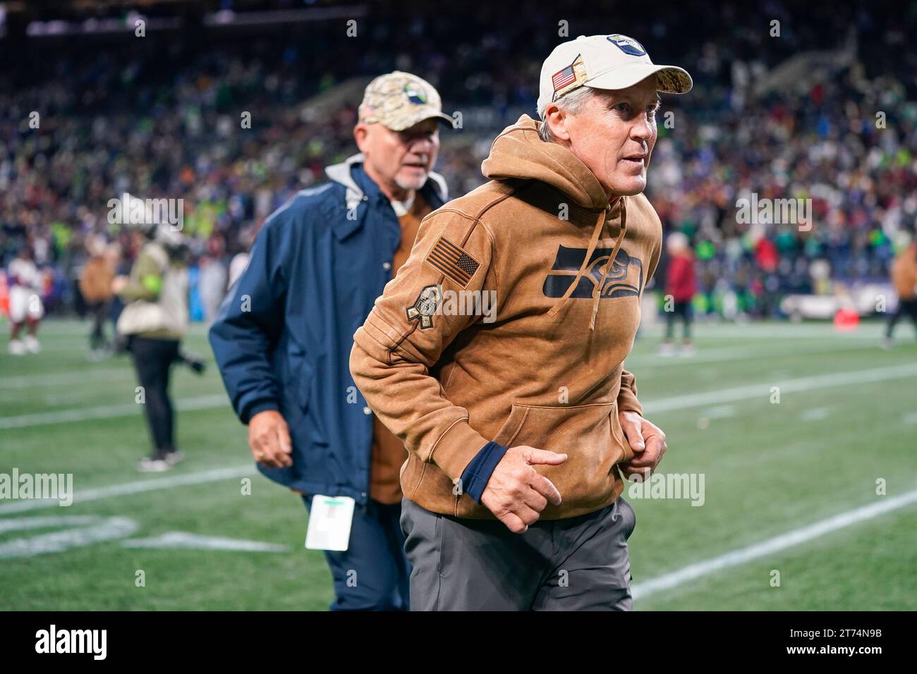 Seattle Seahawks head coach Pete Carroll jogs off the field after a 29 ...