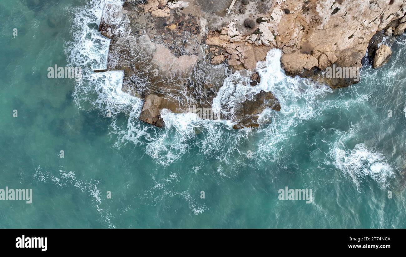 Aerial view of sea waves hitting the rocks with drone high quality ...