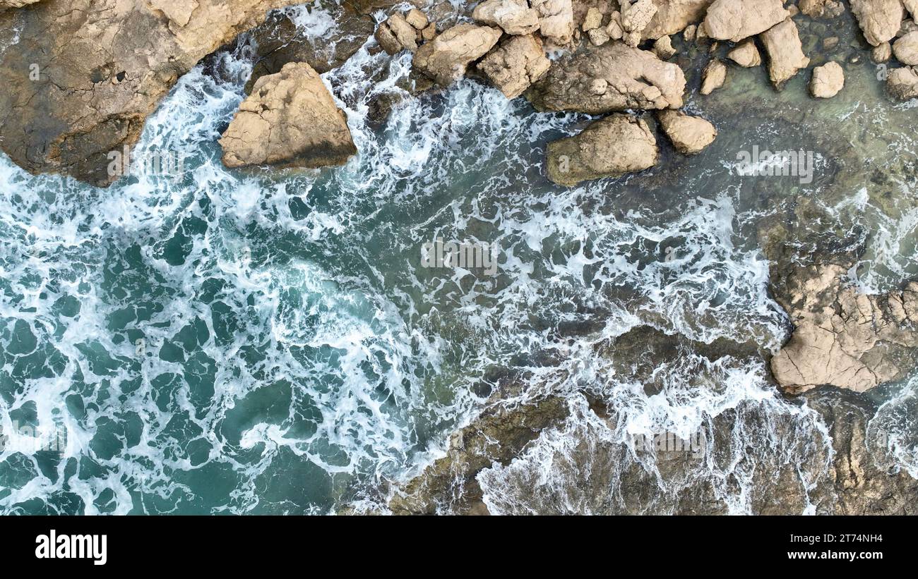Aerial video beach rocks sea hi-res stock photography and images - Alamy