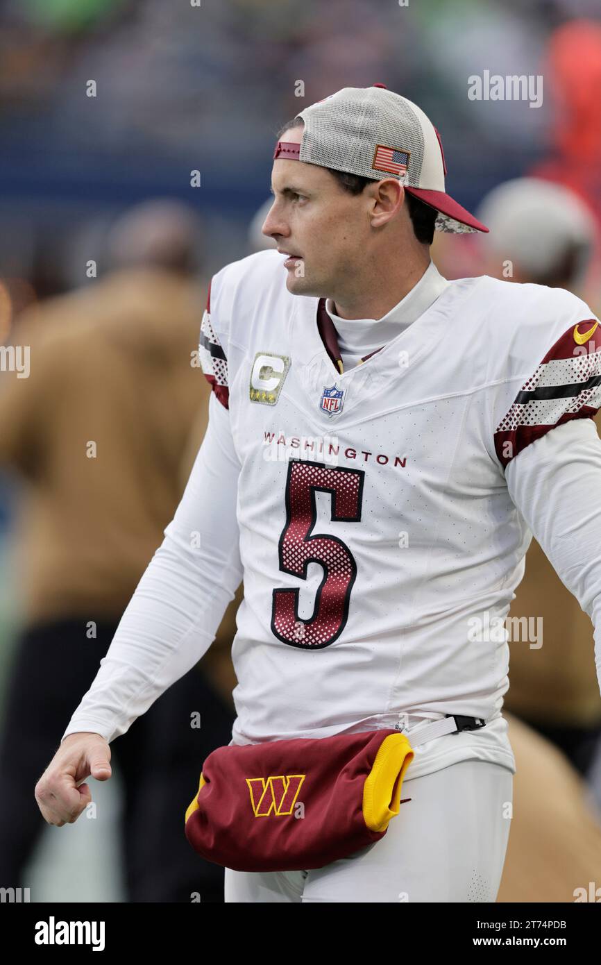 Washington Commanders punter Tress Way walks the sidelines with his ...