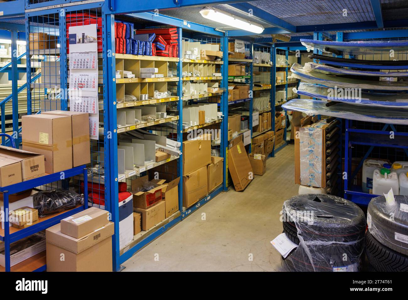 In the car repair shop there are shelves full of spare parts Stock ...