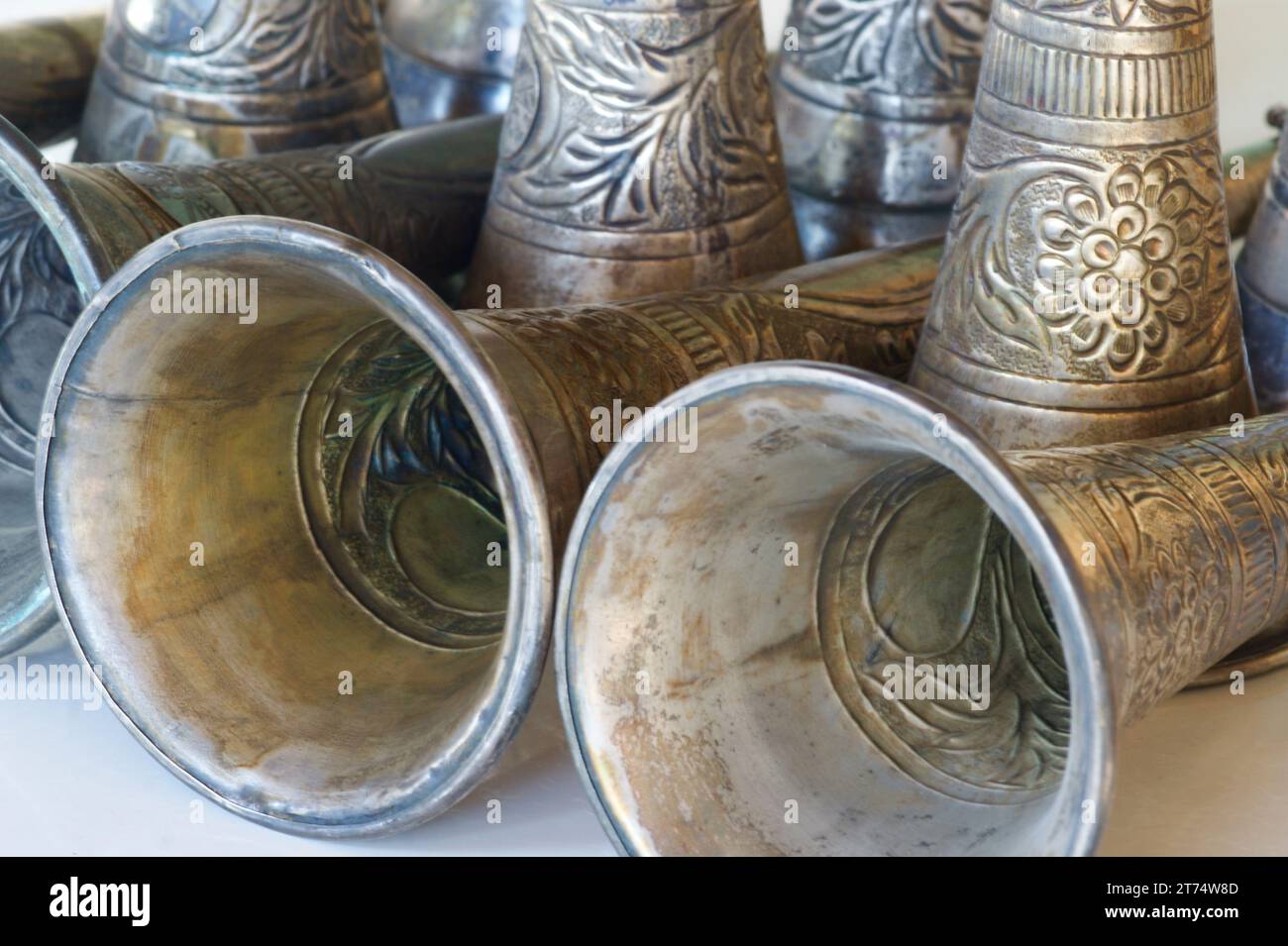 Trumpet duty bugle horns show intricate stamped silver color design, a ...