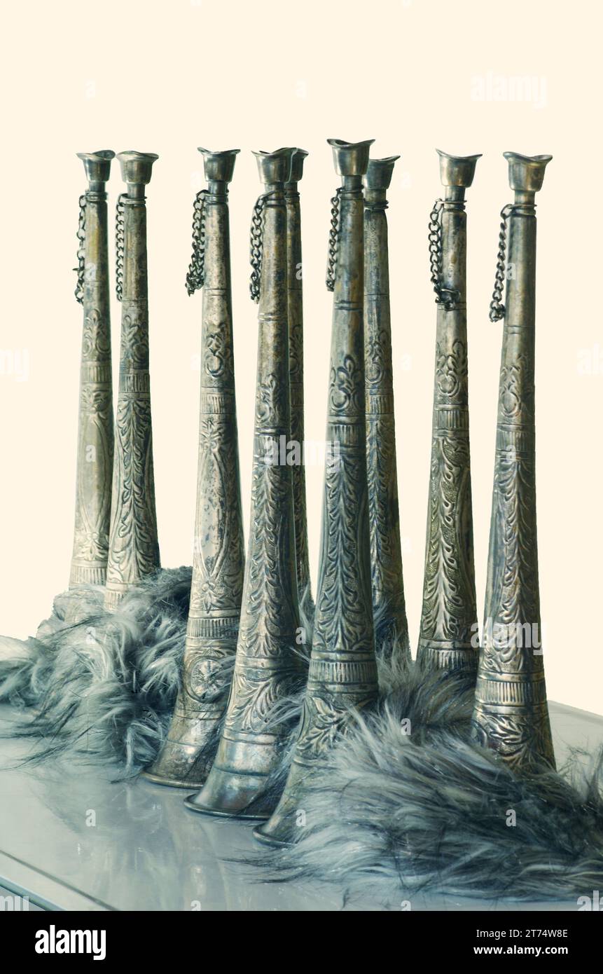 Trumpet duty bugle horns show intricate stamped silver color design, a ...
