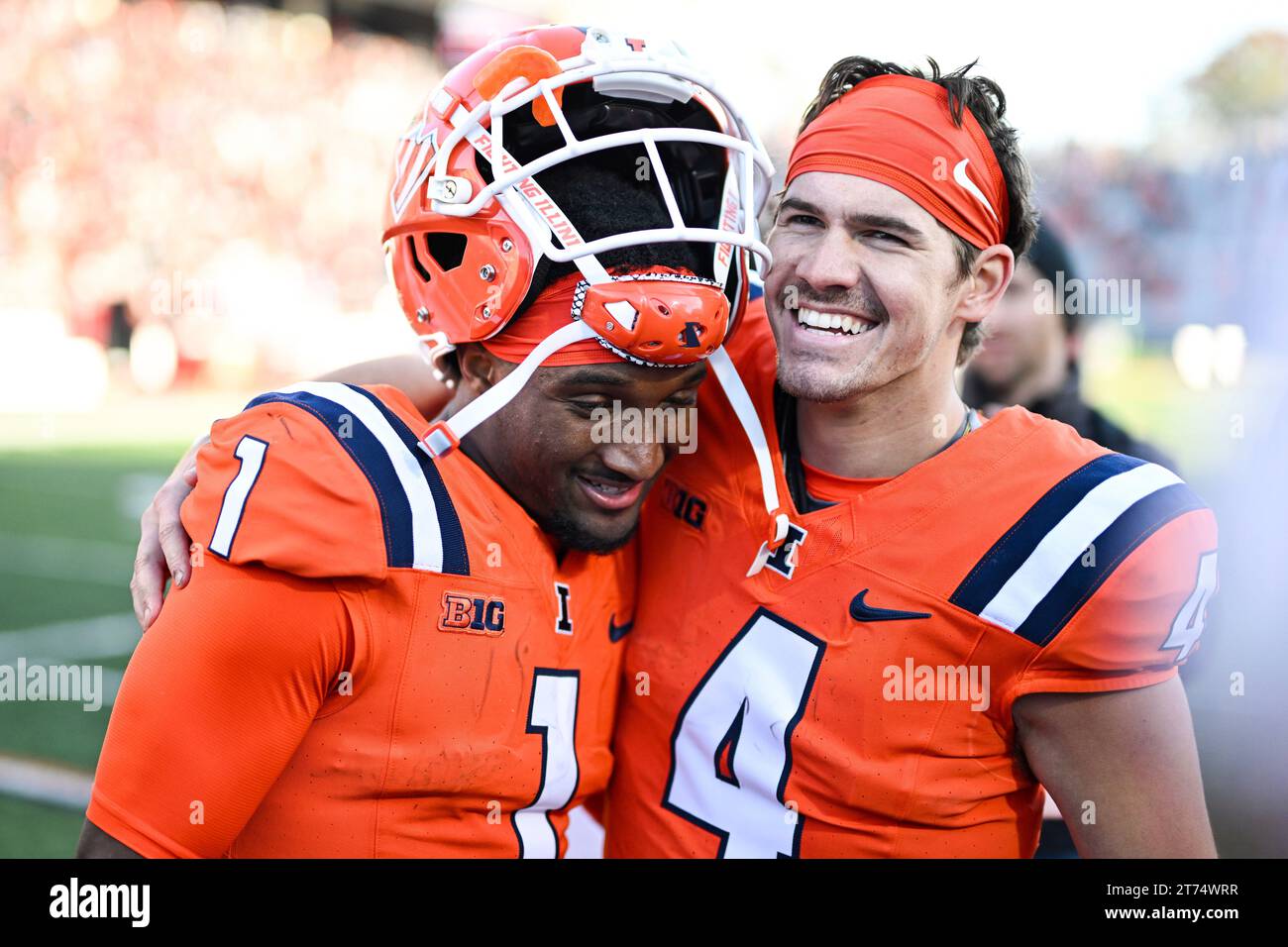CHAMPAIGN, IL - NOVEMBER 11: Illinois QB John Paddock (4) hugs Illinois ...