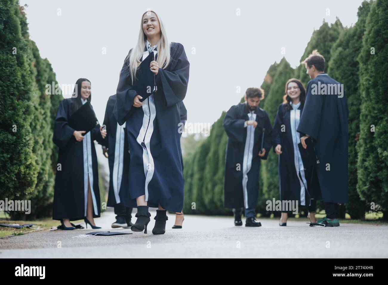 Group of University Students Celebrating Their Graduation in a Park ...